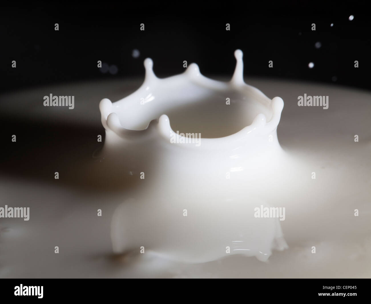 Shapes created by drops of milk and milk splashes Stock Photo - Alamy