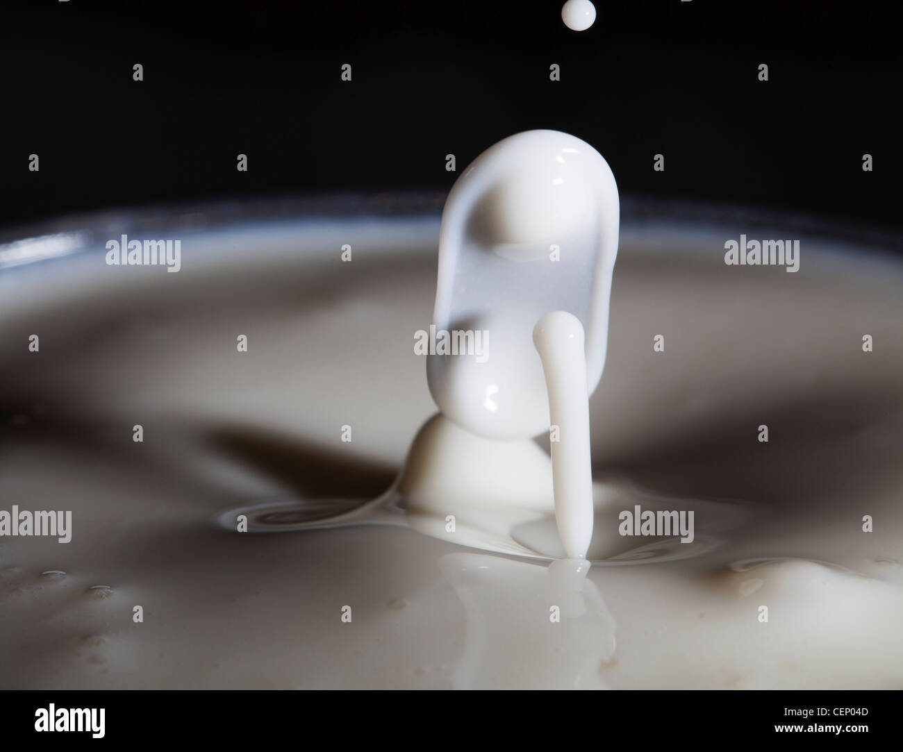 Shapes created by drops of milk and milk splashes Stock Photo - Alamy