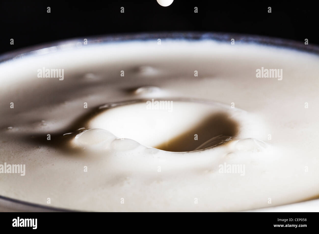 Shapes created by drops of milk and milk splashes Stock Photo - Alamy