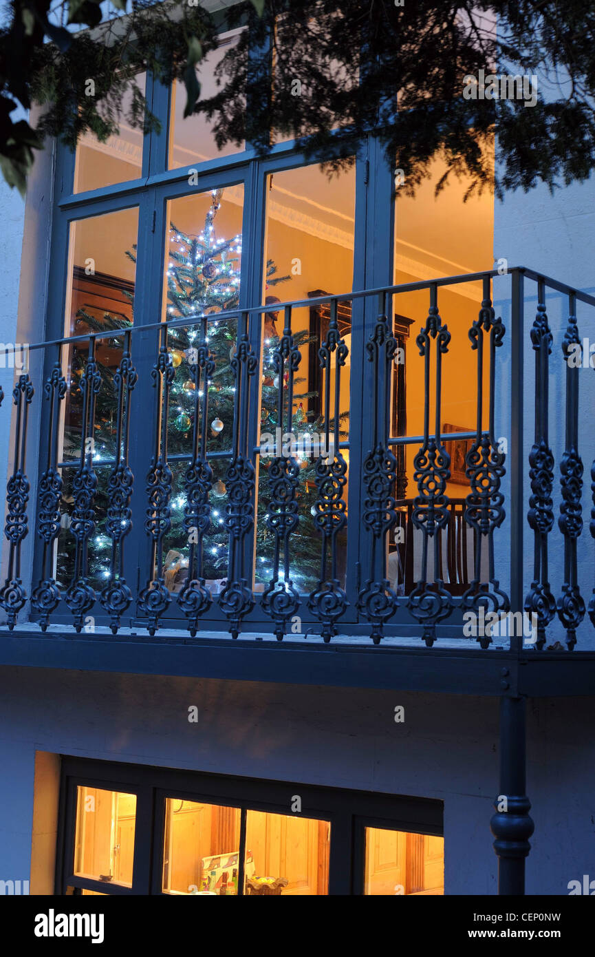 Christmas tree seen through window Stock Photo - Alamy