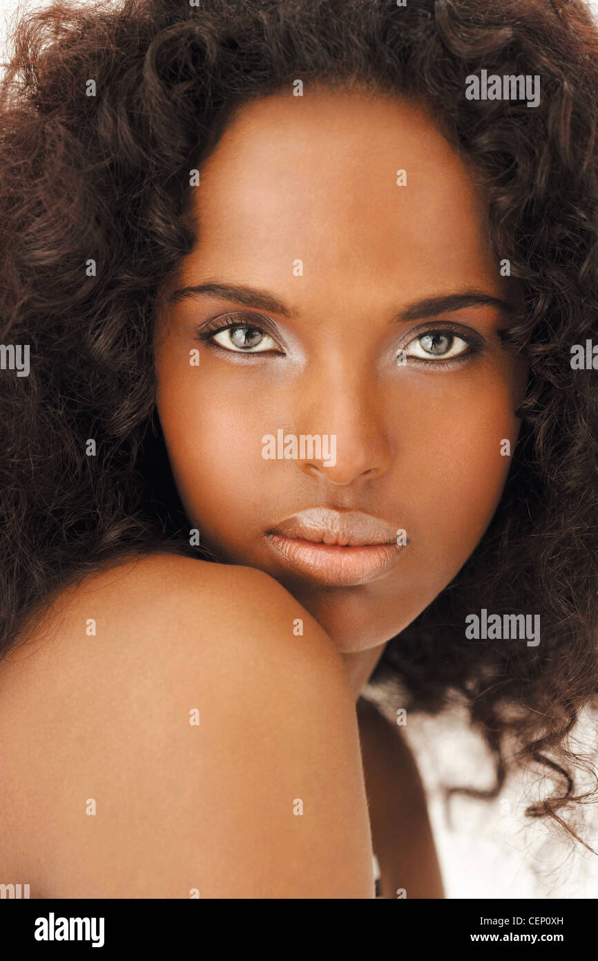 Female looking over shoulder to camera Stock Photo - Alamy