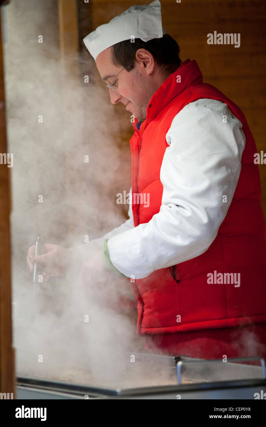 Man cooking German Potato Cakes at Christkindle German Christmas Market ...