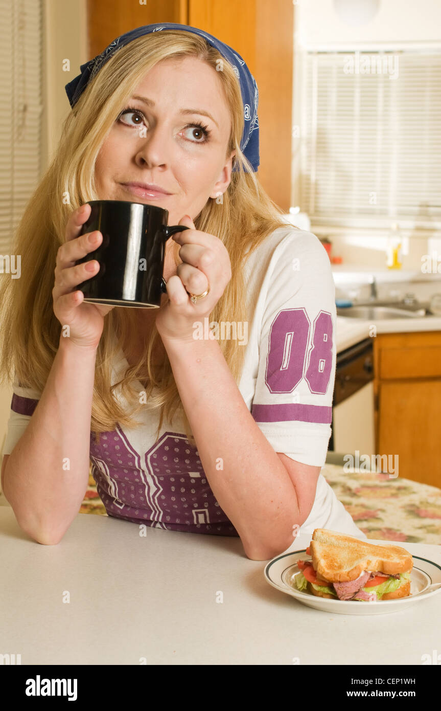 Taking a break from housework Stock Photo - Alamy