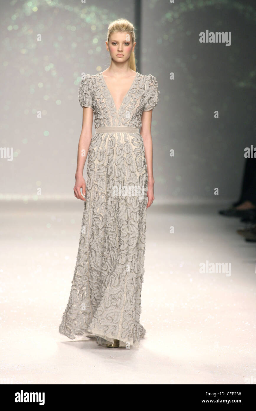 Textured grey ruffled long dress with short sleeves and waistband Stock ...