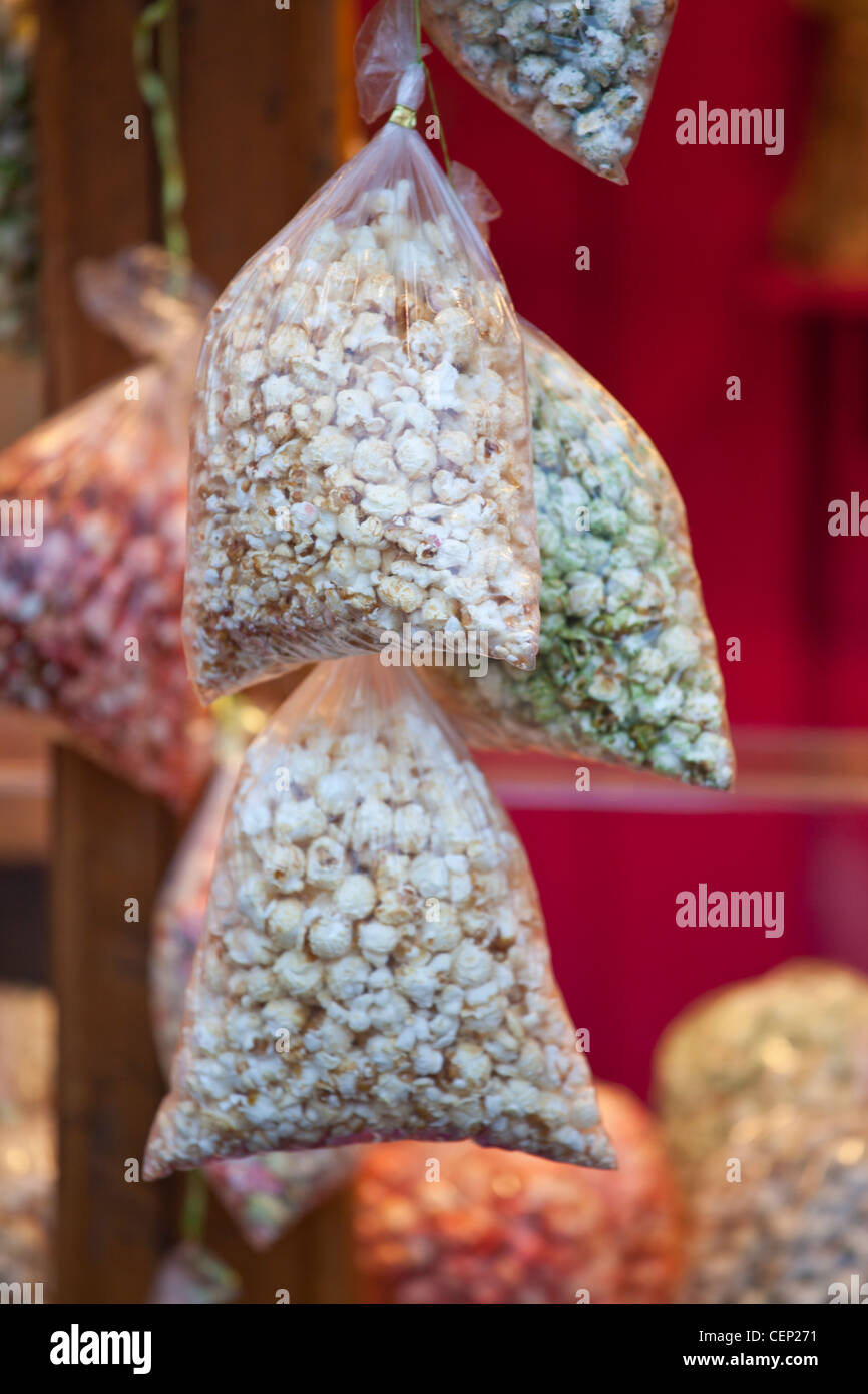 Bags of Popcorn hanging at a market stall in Leeds, West Yorkshire, UK ...