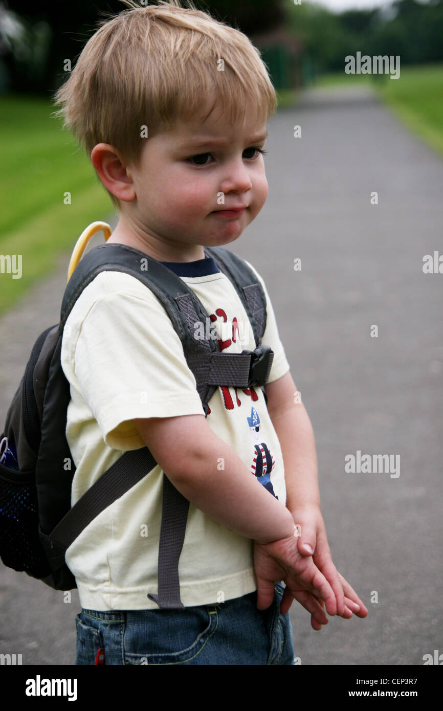 Male child wearing a backpack Stock Photo - Alamy