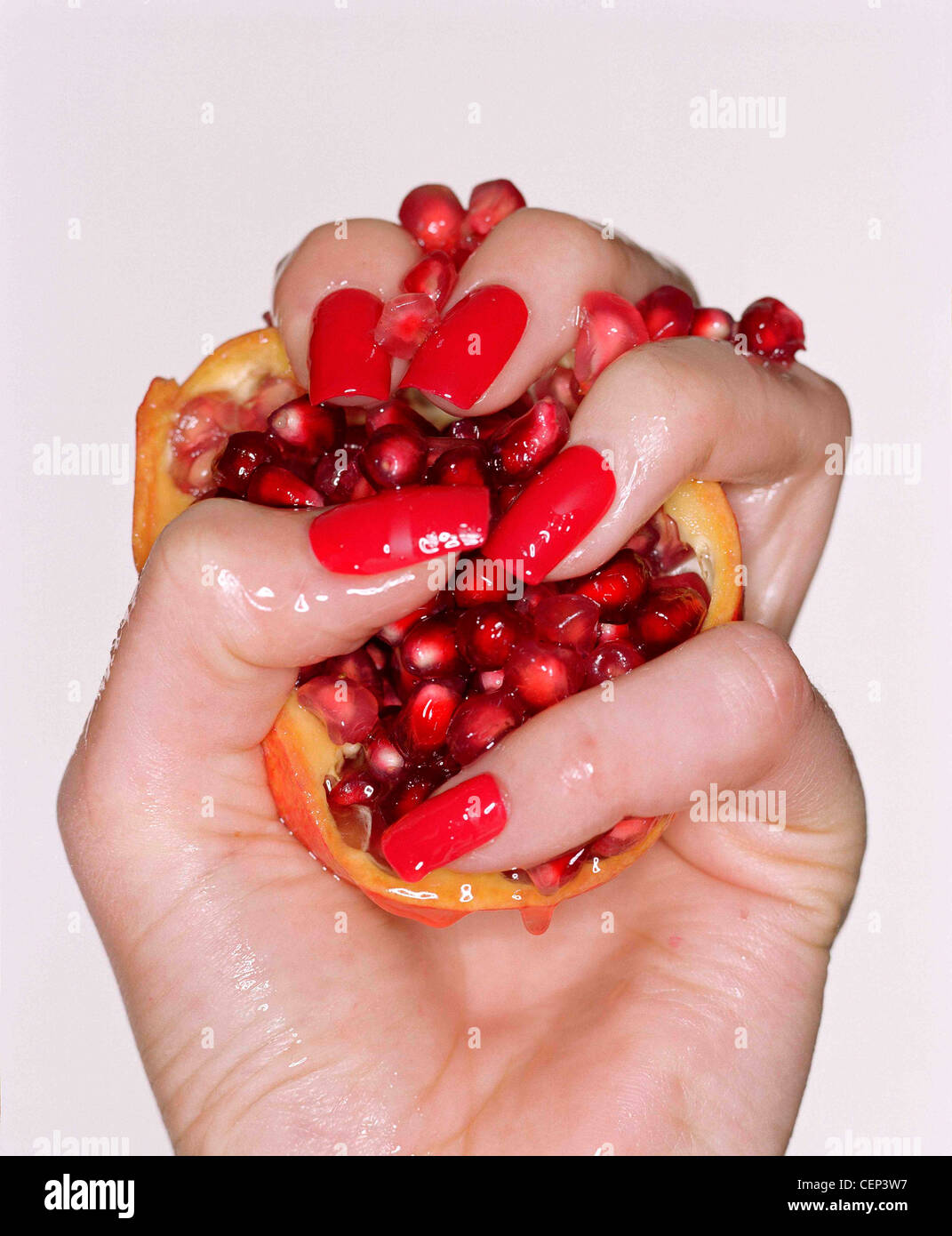 Hand squashing fruit hi-res stock photography and images - Alamy
