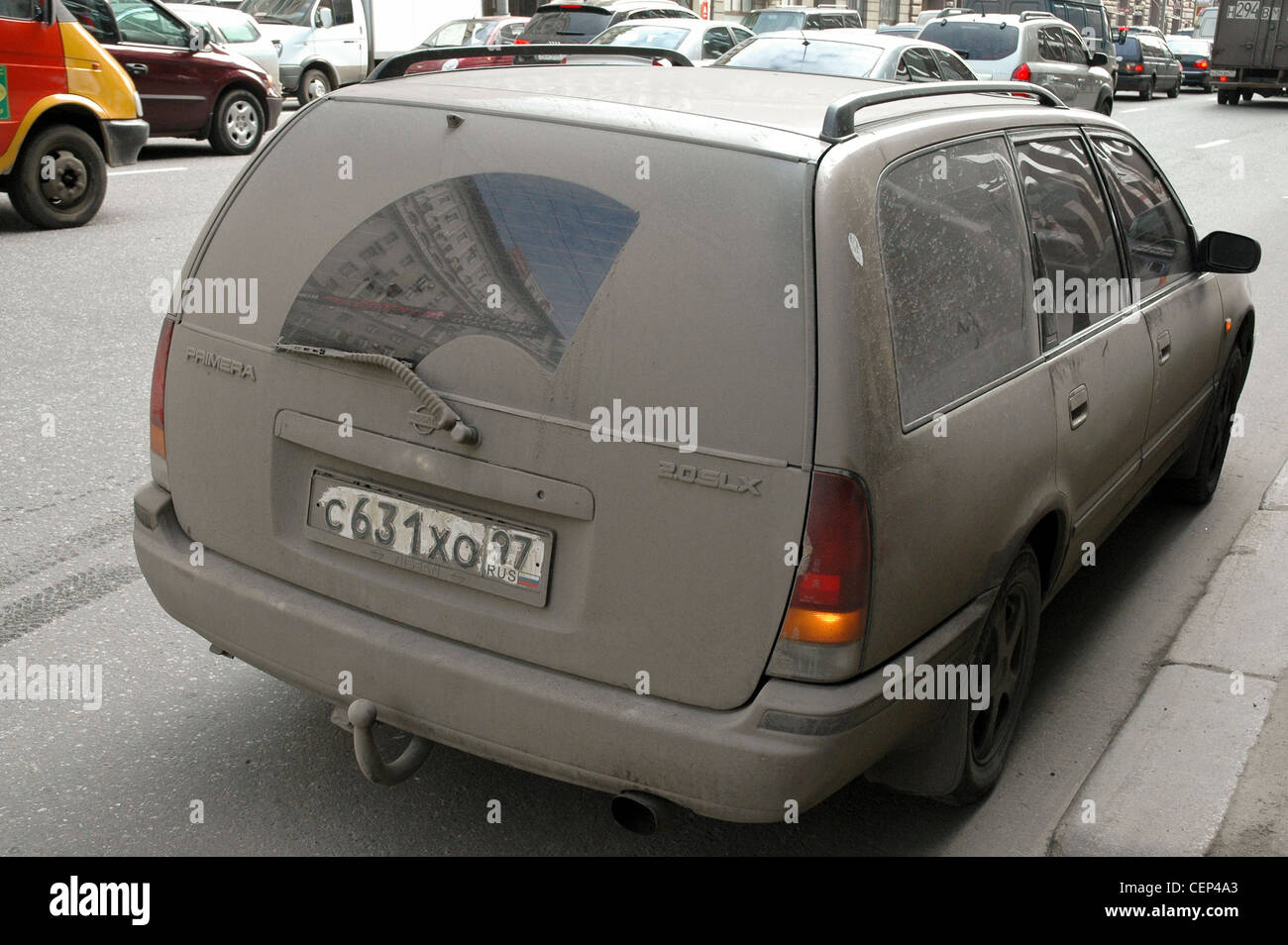 A dirty car in Moscow, Russia, coated in a thick layer of dirt and ...
