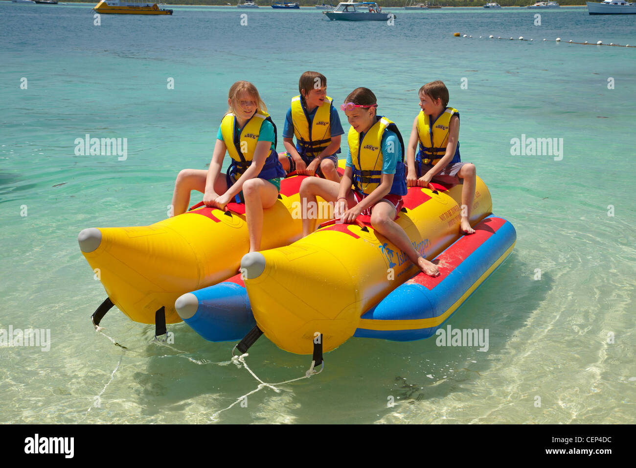 Children on banana boat, Plantation Island Resort, Malolo Lailai Island ...