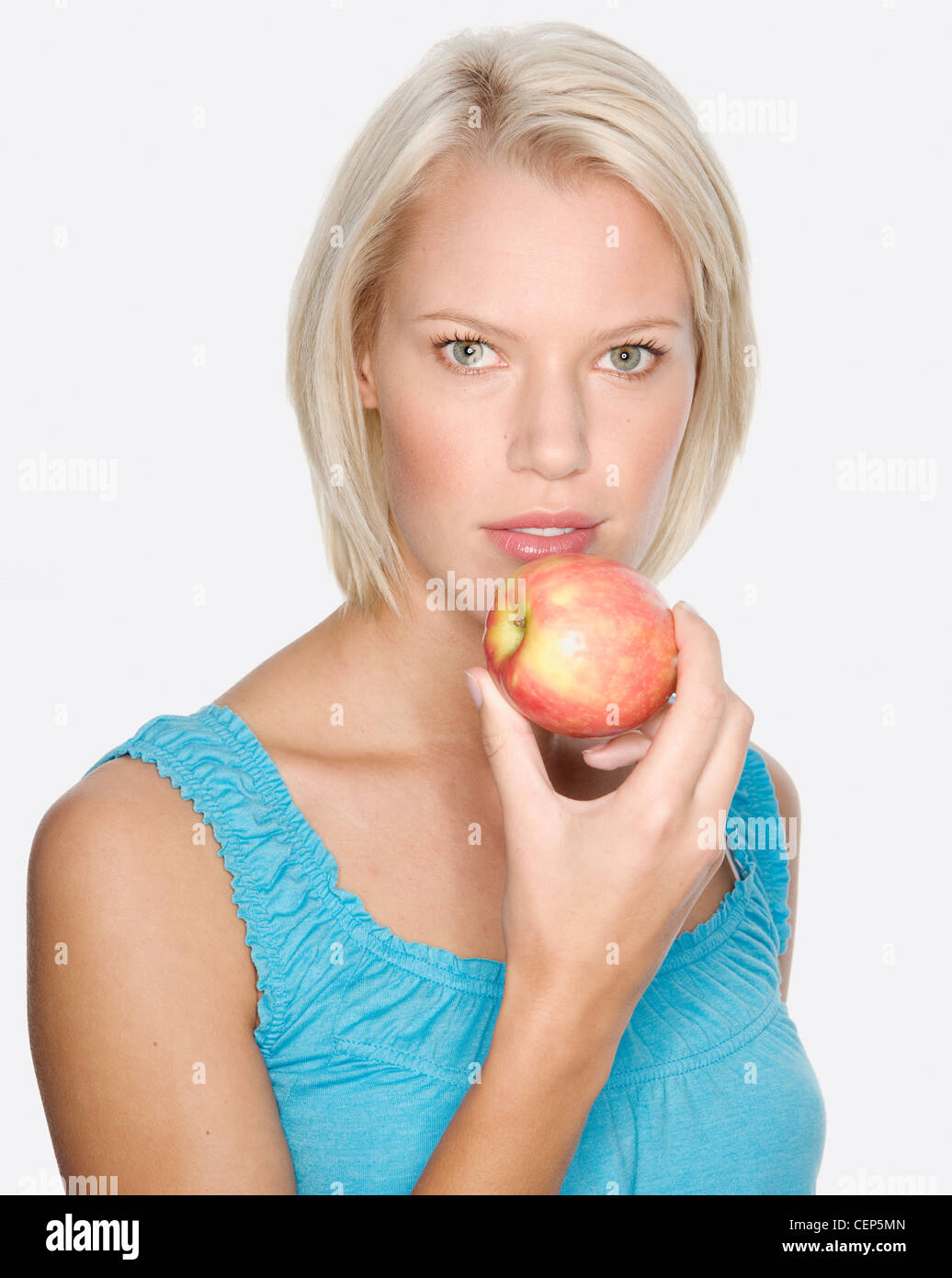 Female holding an apple Stock Photo - Alamy