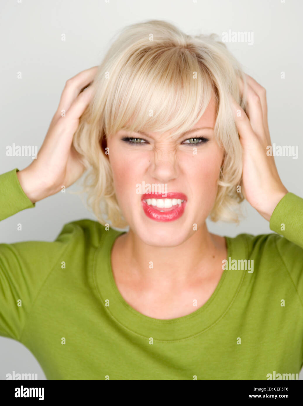 Female pulling a face Stock Photo - Alamy