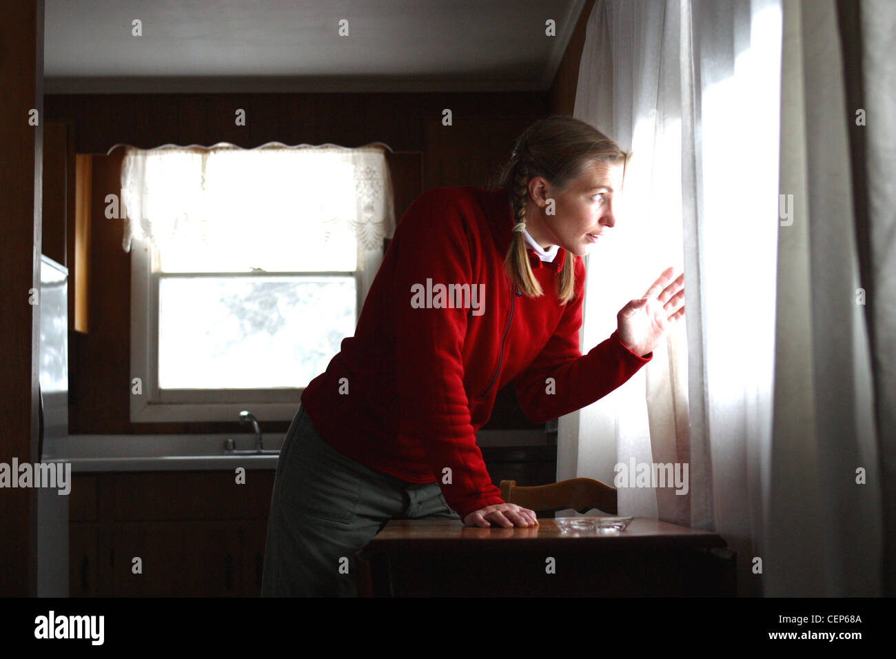 Woman Looking out Cabin Window Stock Photo - Alamy