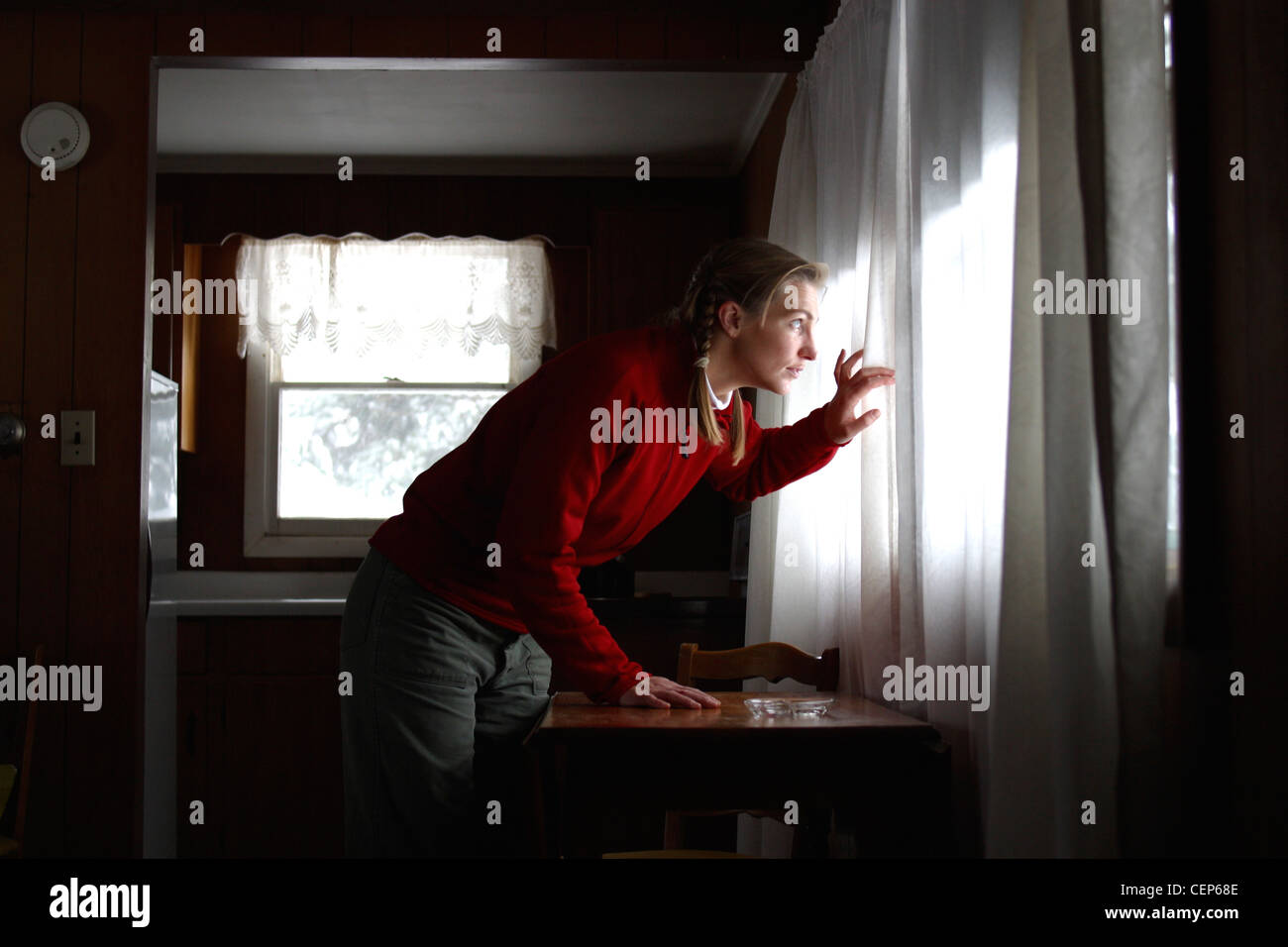 Woman Looking out Cabin Window Stock Photo - Alamy