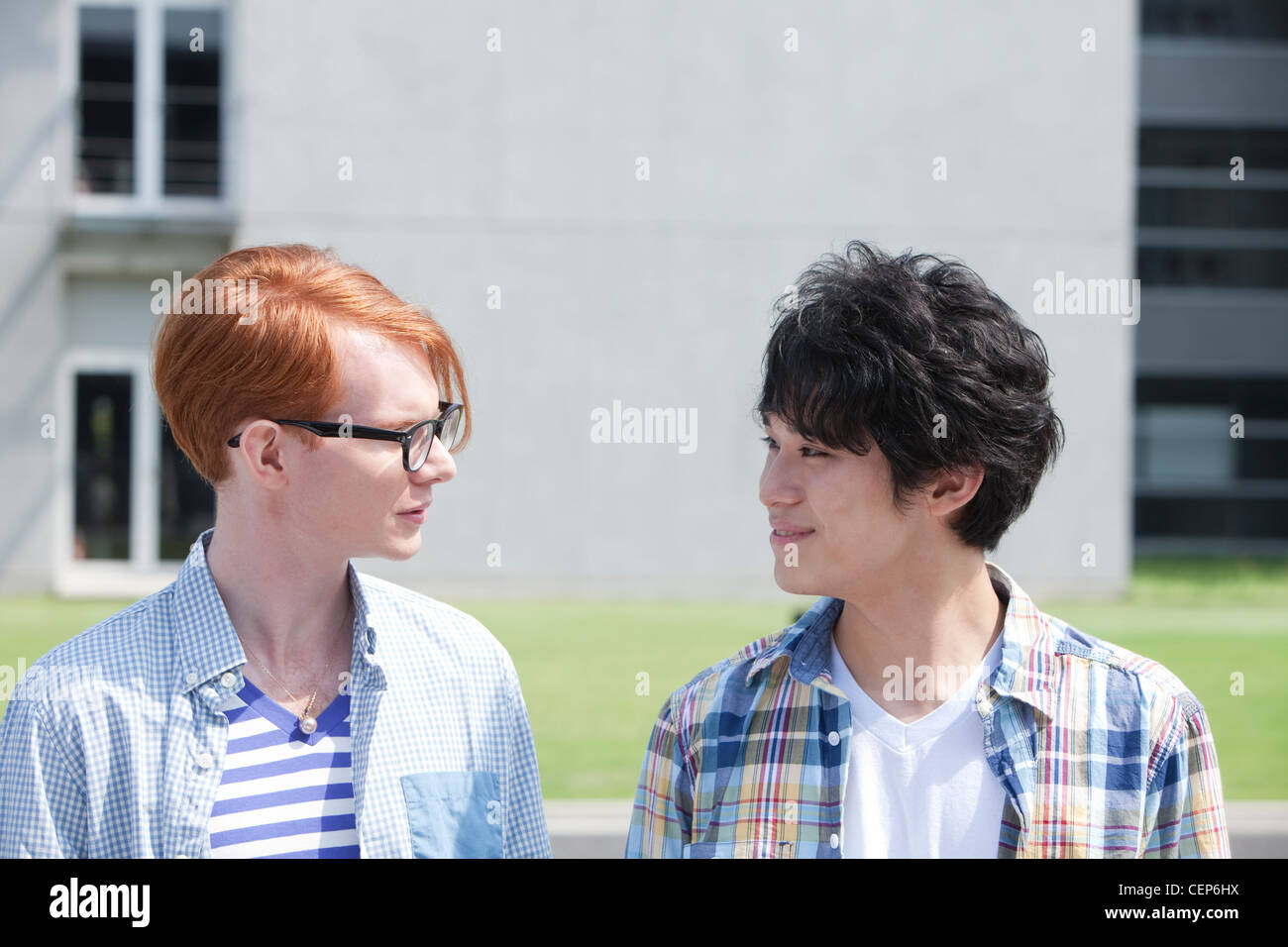 Two young men talking at campus Stock Photo - Alamy Two young men talking at campus Stock Photo - Alamy