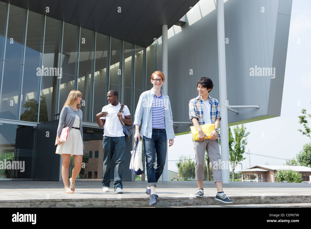 University students walking at campus Stock Photo - Alamy