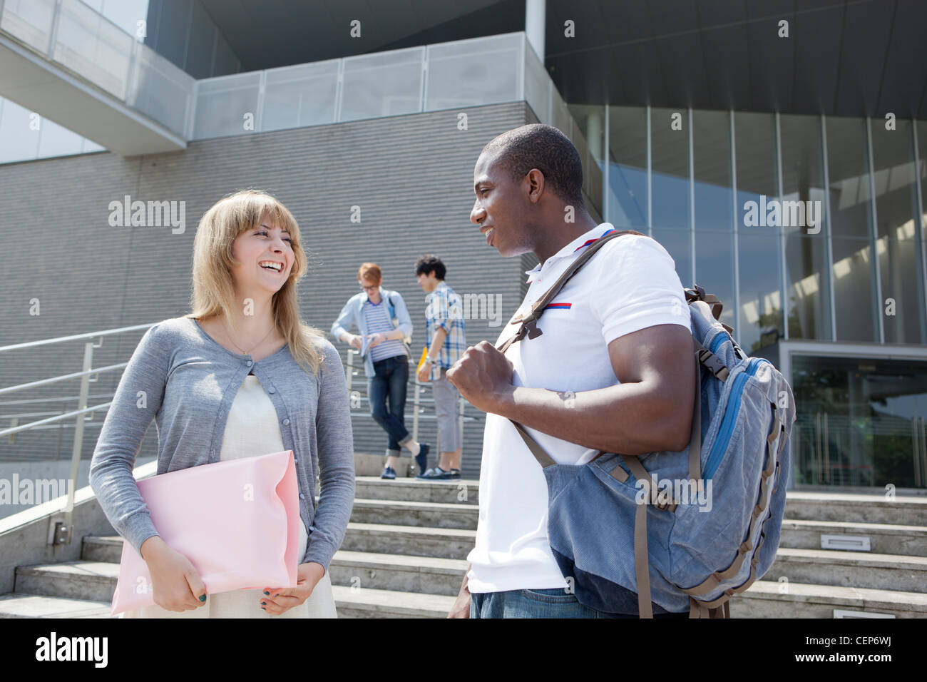University students talking at campus Stock Photo - Alamy