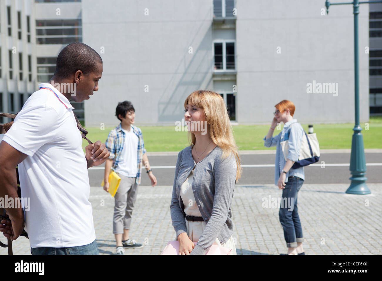 University students talking at campus Stock Photo - Alamy