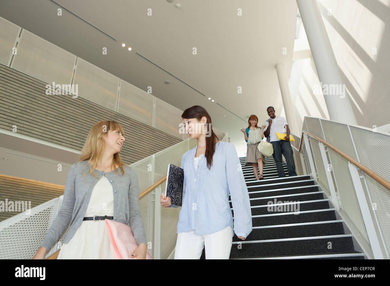 University students getting down stairs Stock Photo - Alamy