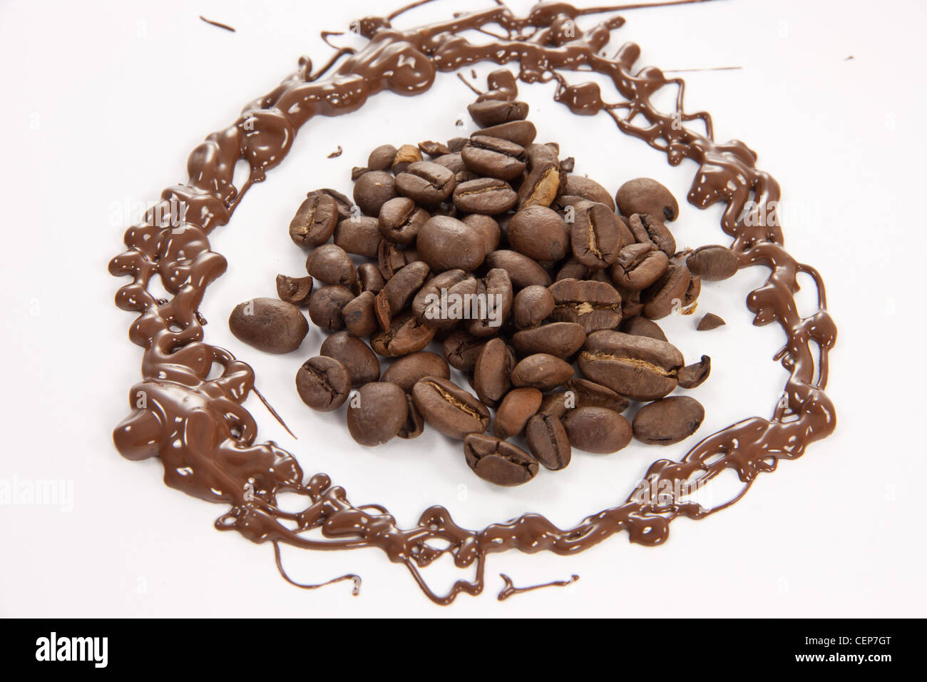 Coffee beans surrounded by melted chocolate Stock Photo - Alamy