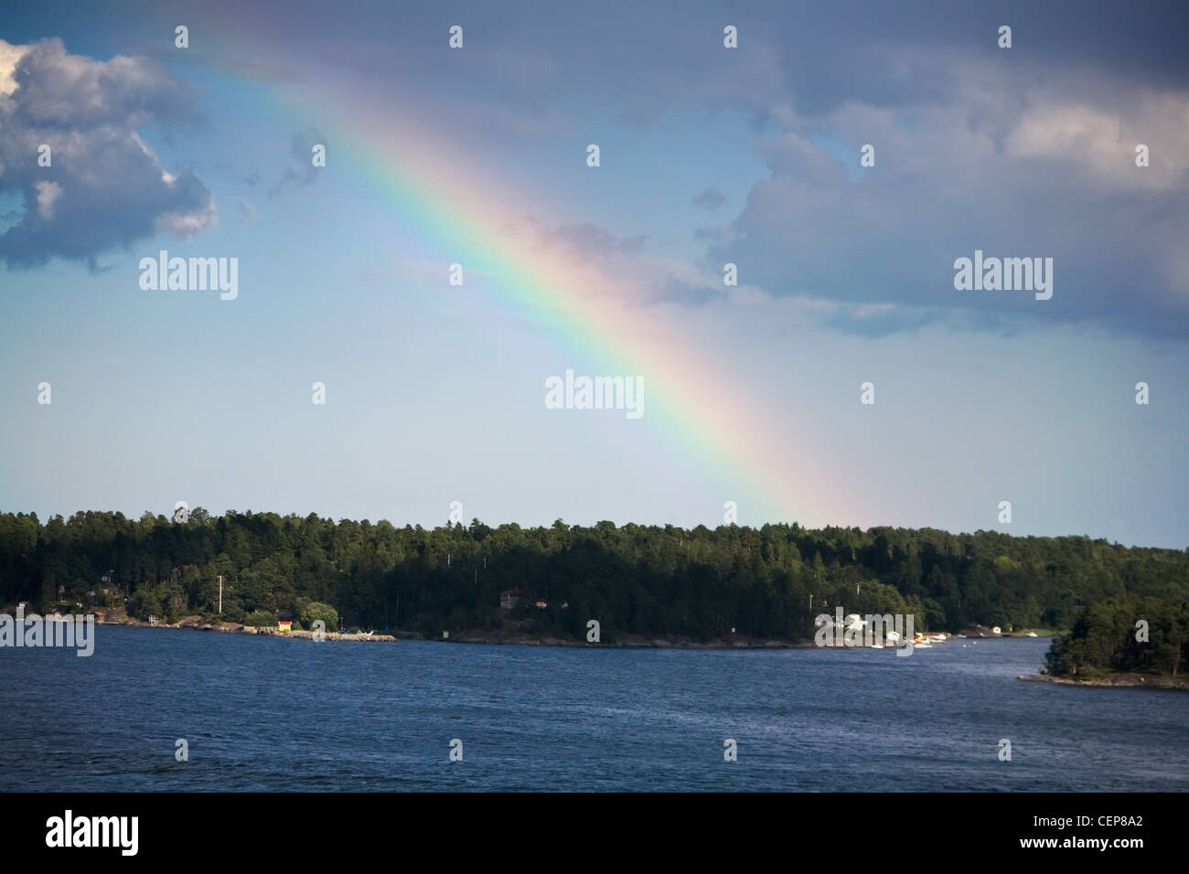 a rainbow over a lake; stockholm, sweden Stock Photo - Alamy