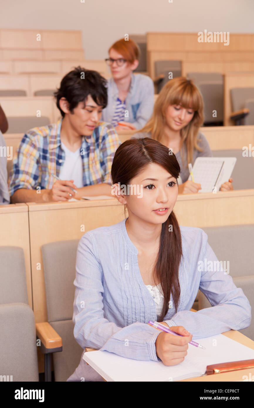 University students studying in lecture theater Stock Photo - Alamy