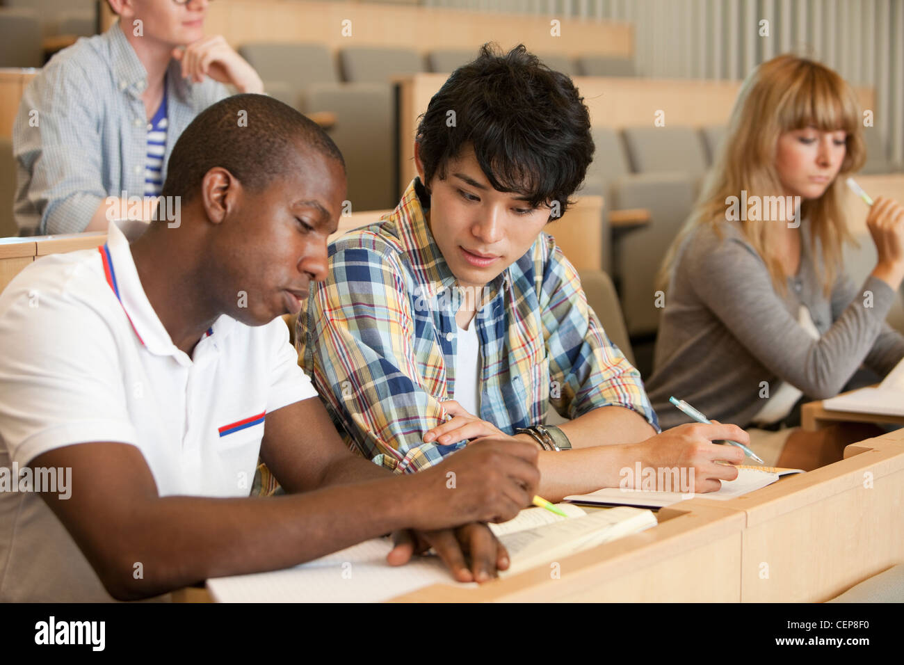 University students studying in lecture theater Stock Photo - Alamy