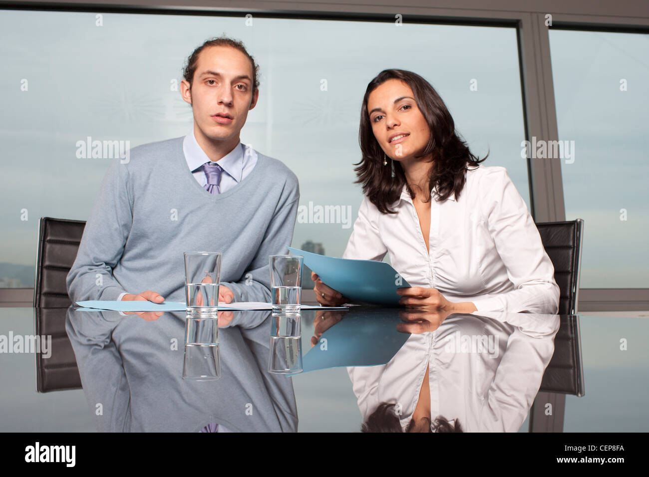 Insurance agent with client in a nice office Stock Photo - Alamy