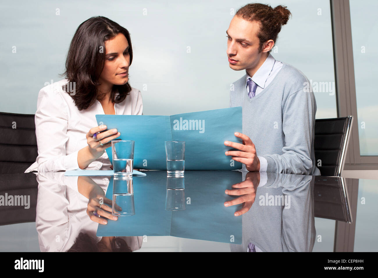 Insurance agent with client in a nice office Stock Photo - Alamy