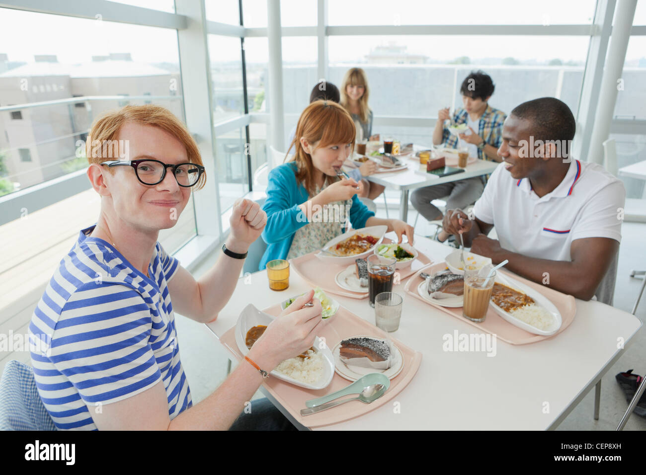 University students having lunch at cafeteria Stock Photo - Alamy