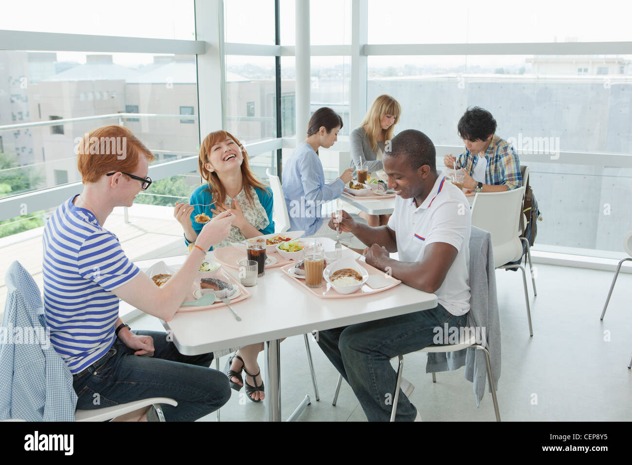 University students having lunch at cafeteria Stock Photo - Alamy