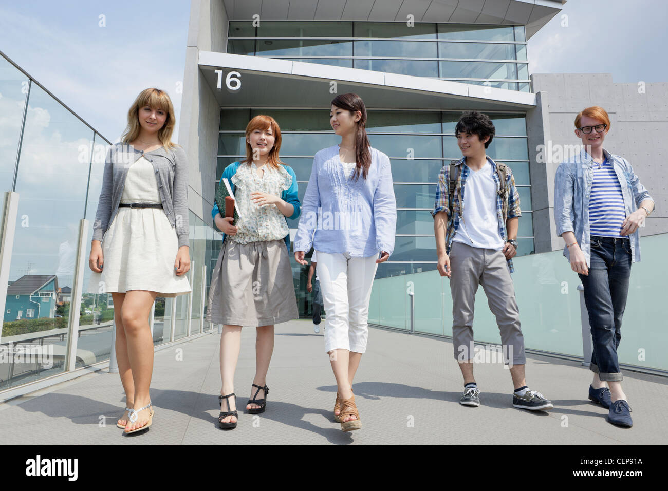 University students walking at campus Stock Photo - Alamy