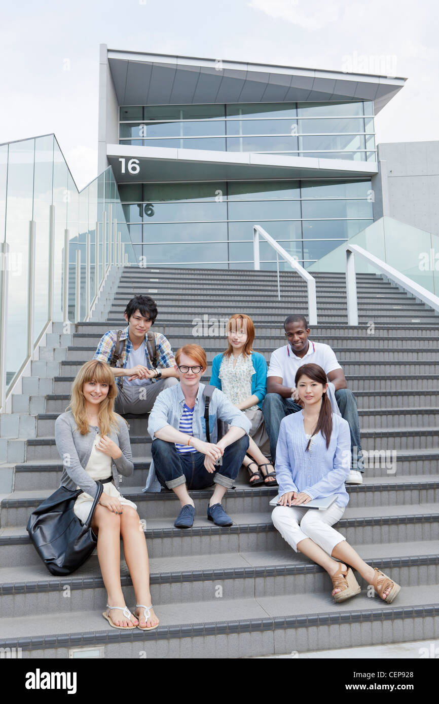 University students sitting on steps Stock Photo - Alamy