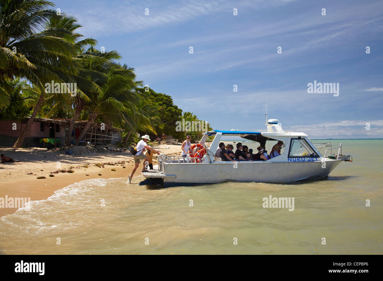 Tourists at Solevu Village (Shell Village), Malolo Island, Mamanuca ...
