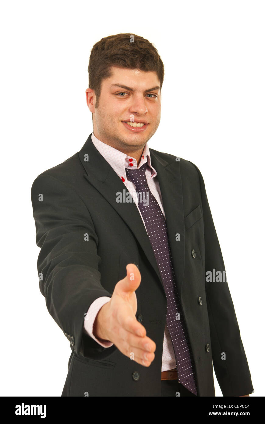 Young business man giving hand for shaking isolated on white background ...