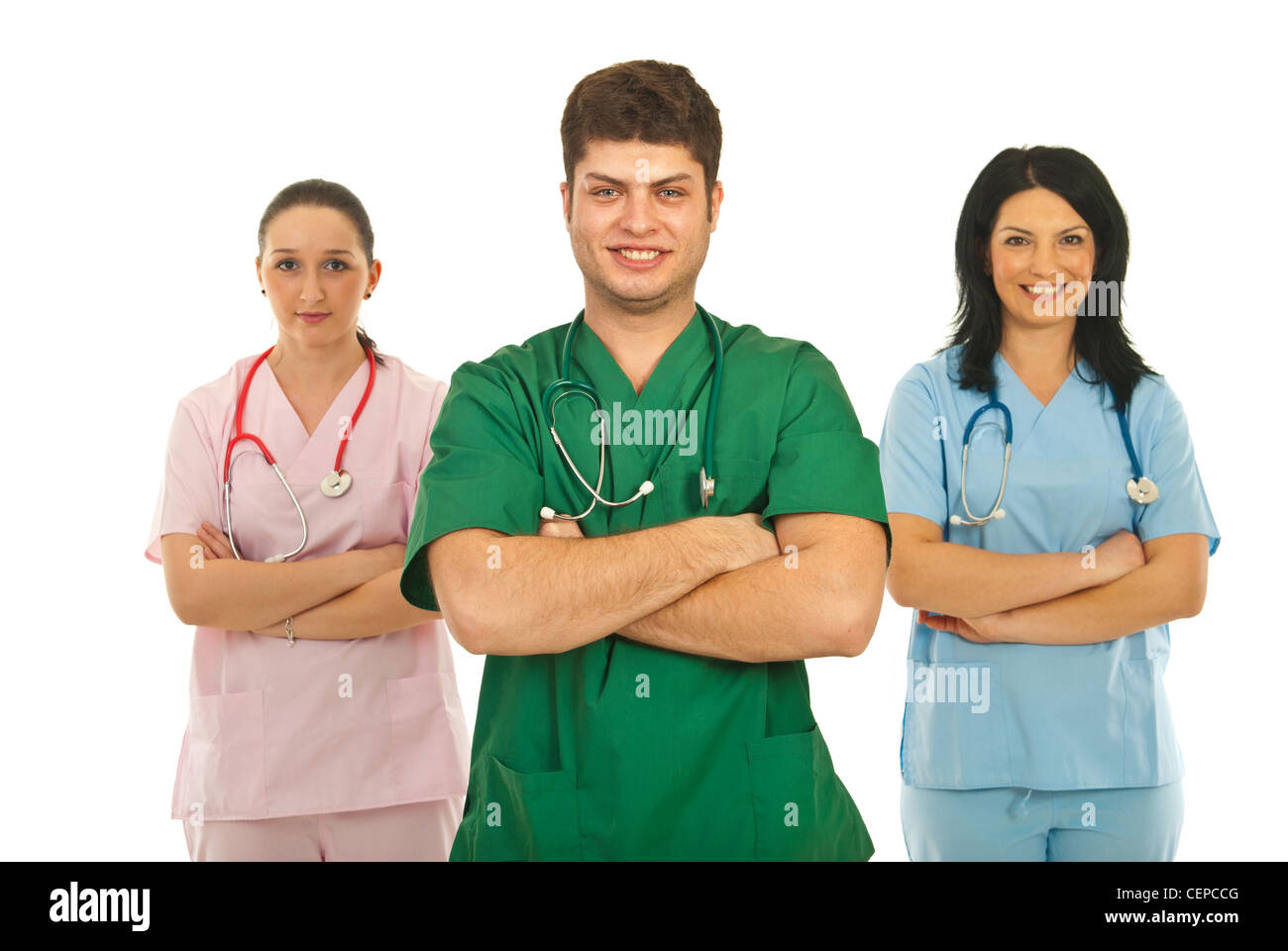 Cheerful team of three doctors standing with arms folded isolated on ...