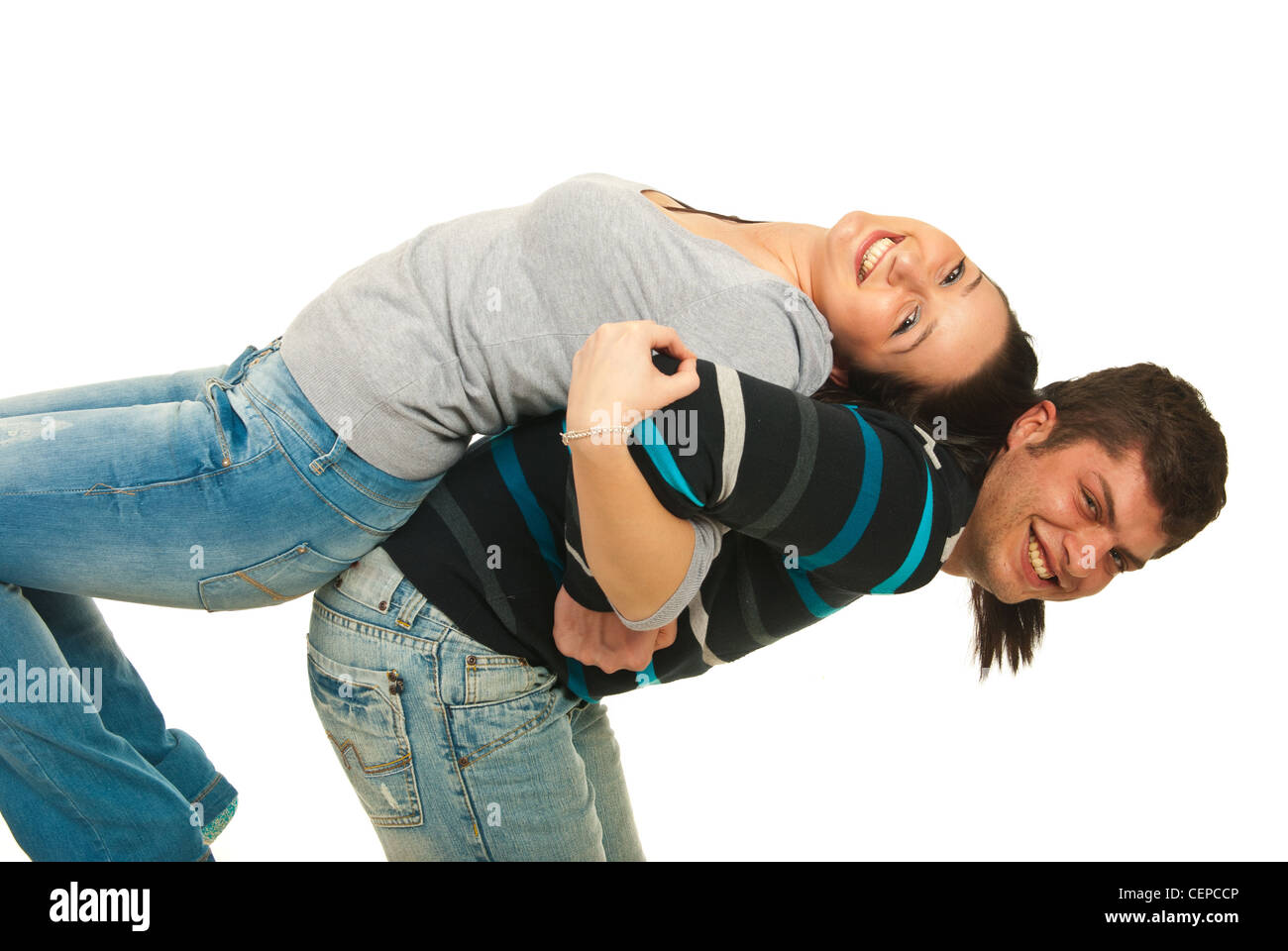 Happy young couple having fun together isolated on white background ...