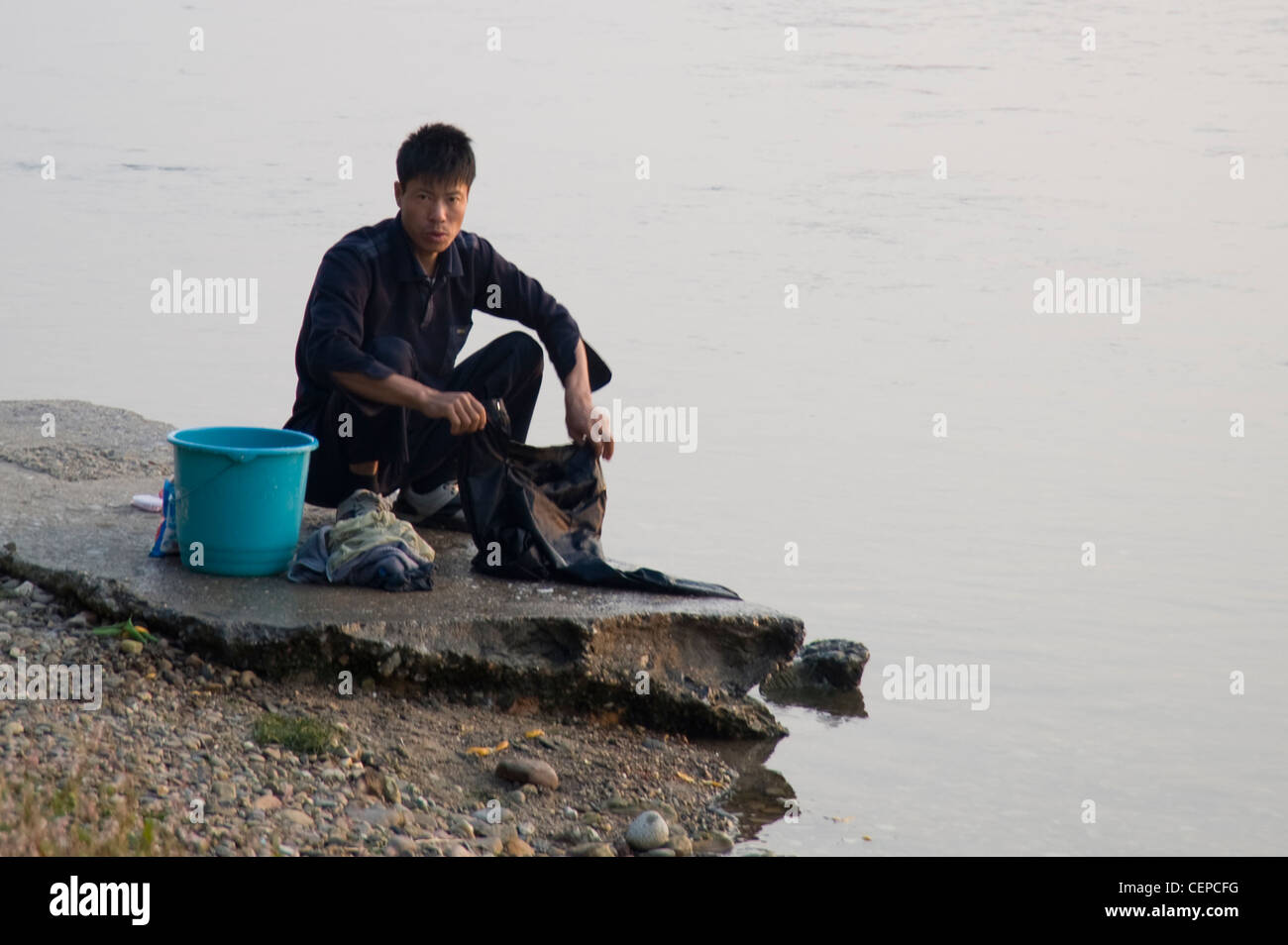 Man Doing Laundry In Li River Stock Photo - Alamy