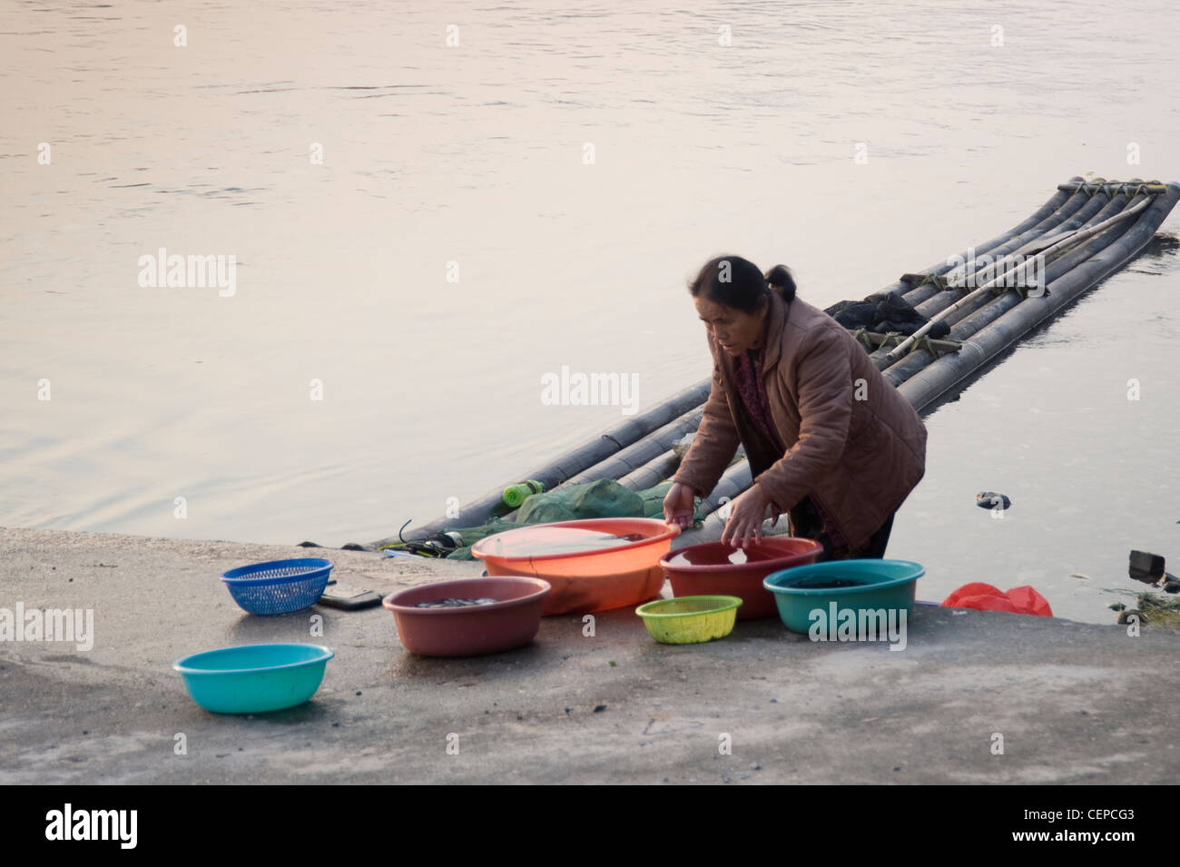 Woman With A Raft By A River Stock Photo - Alamy