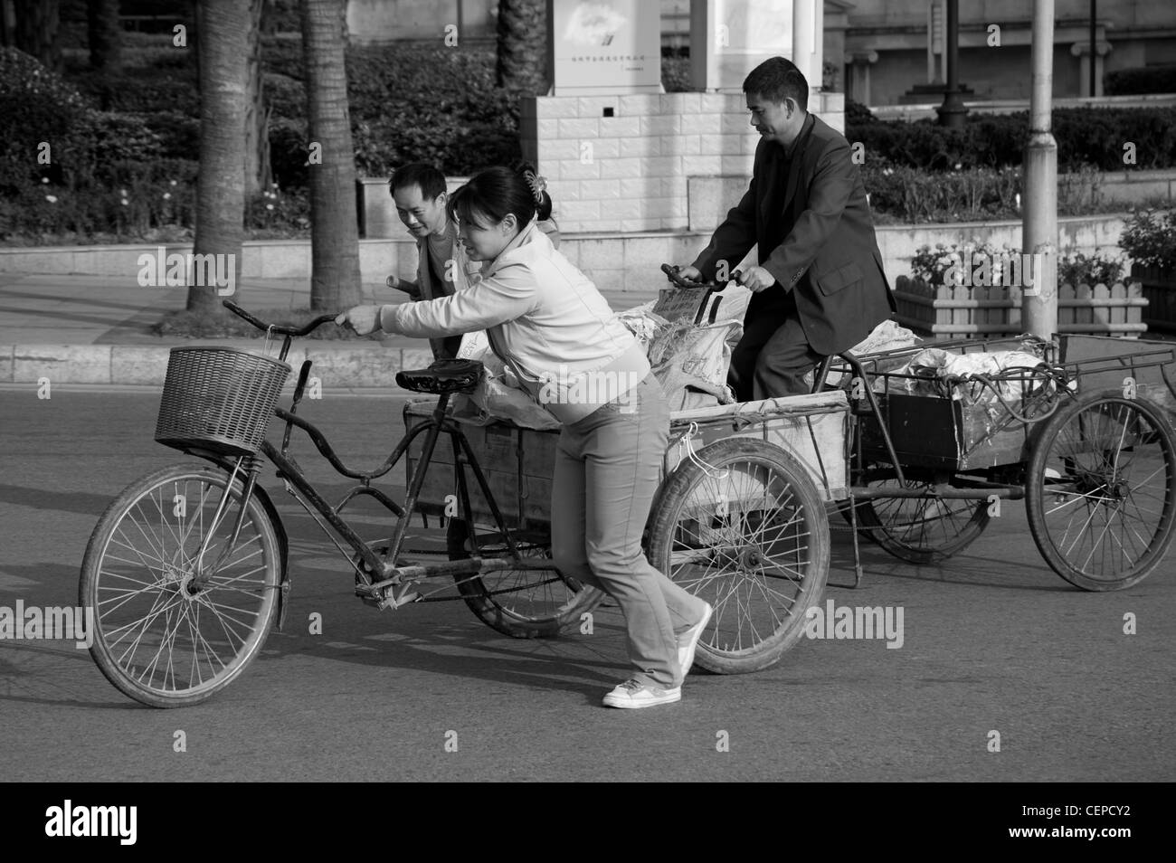 People Riding Tricycles Stock Photo - Alamy