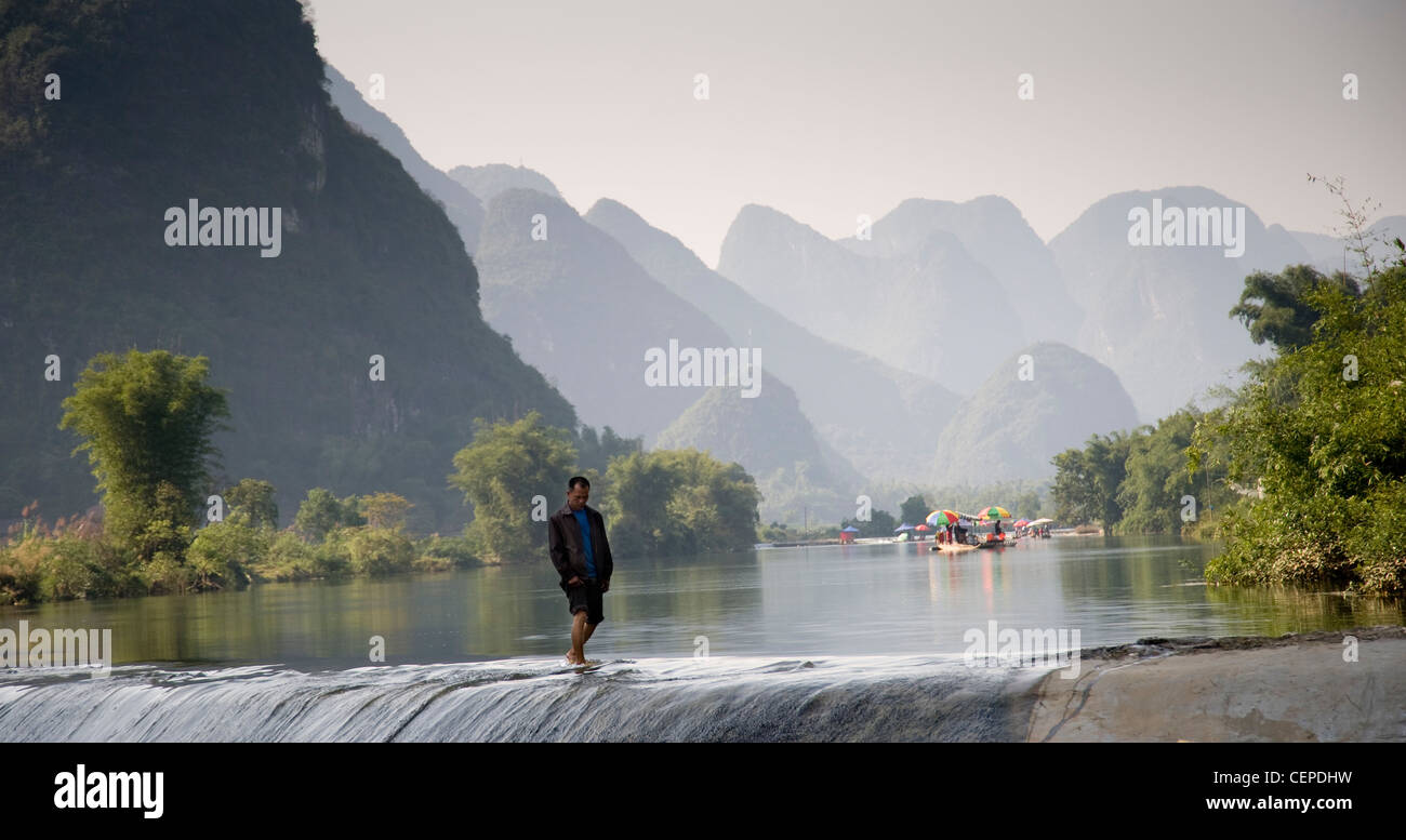 Man Walking Along Yulong River; Guangxi Zhuang,China Stock Photo - Alamy