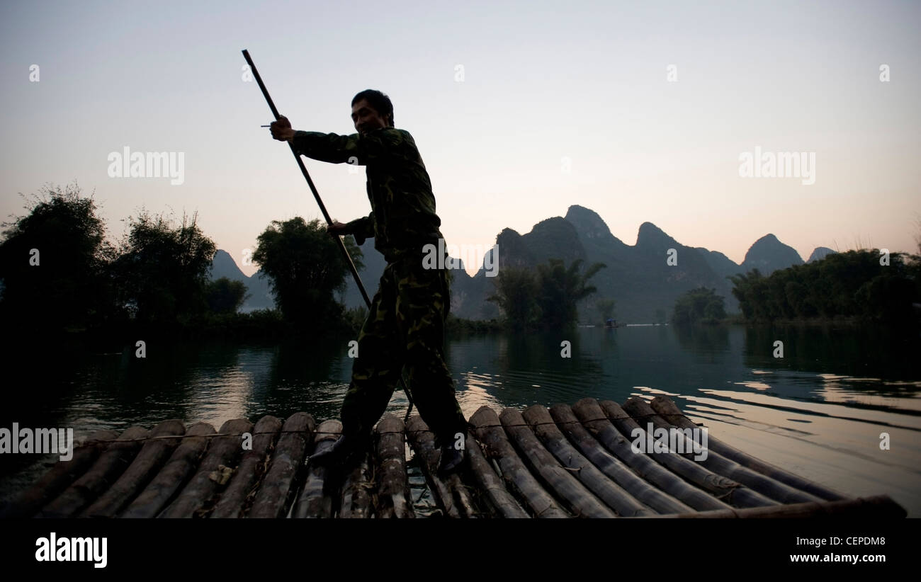 Man On A Raft In A River; Guangxi Zhuang,China Stock Photo - Alamy