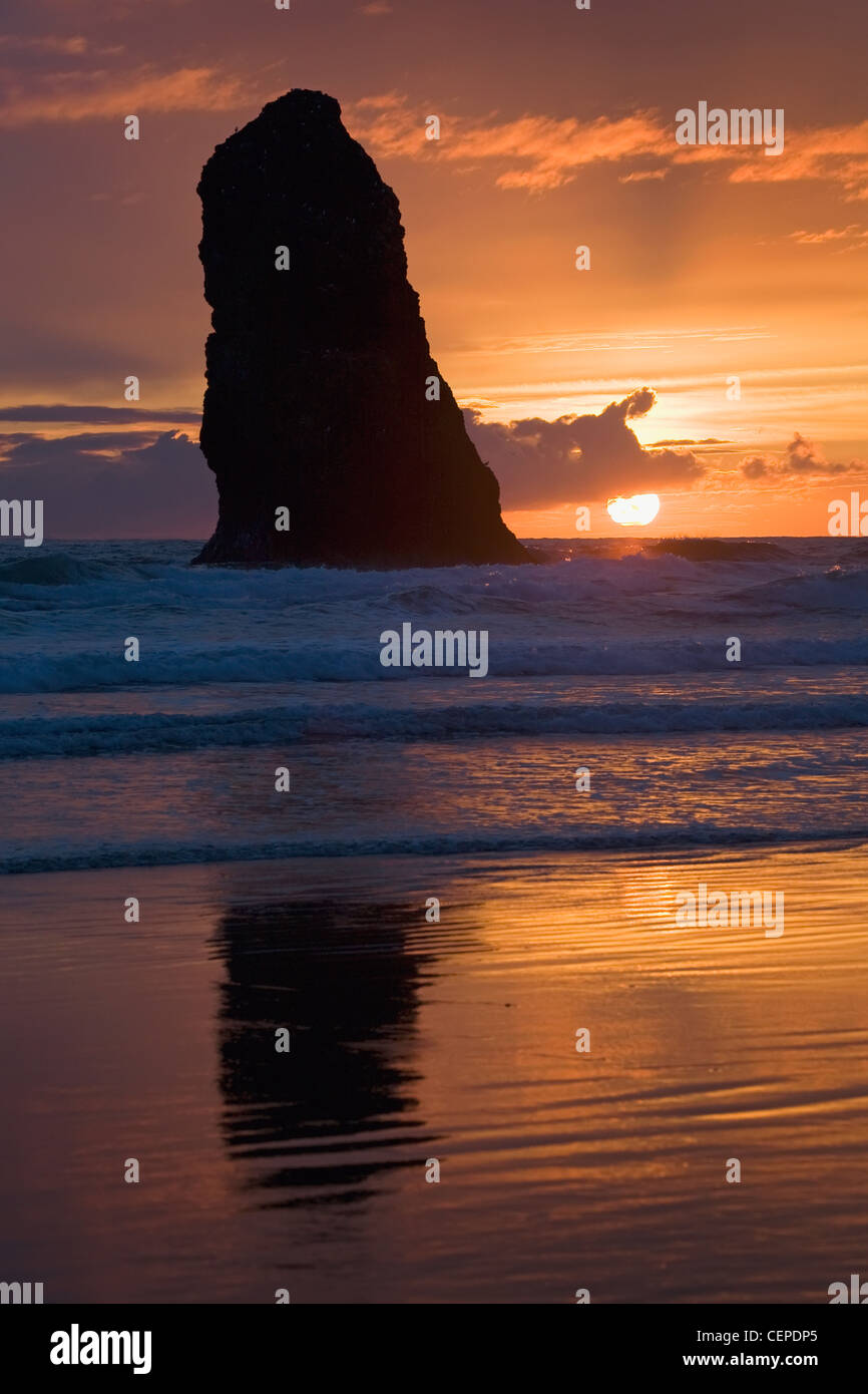 silhouette of a rock formation at sunset; cannon beach, oregon, united ...