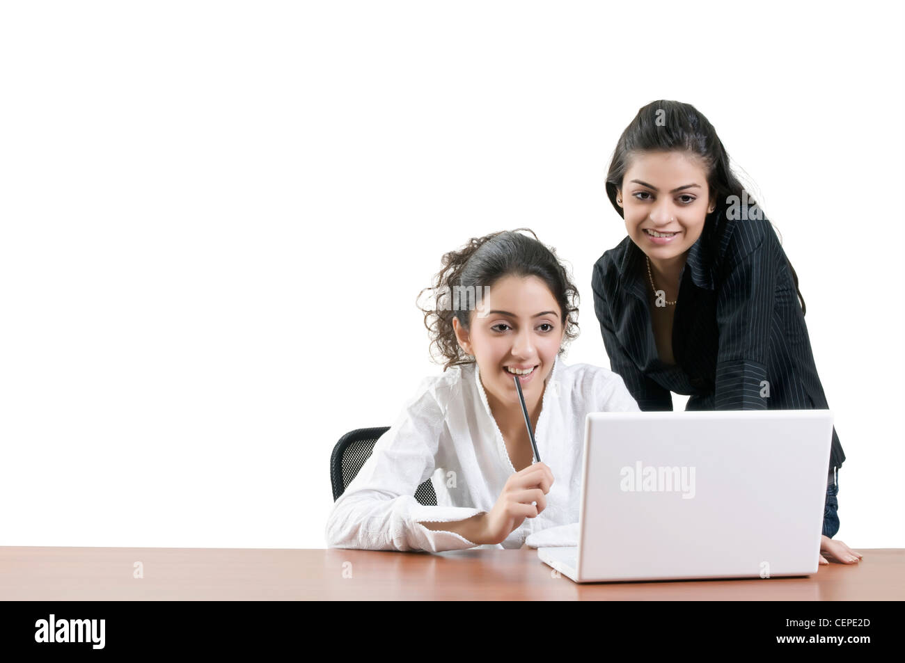 two girls working Stock Photo - Alamy