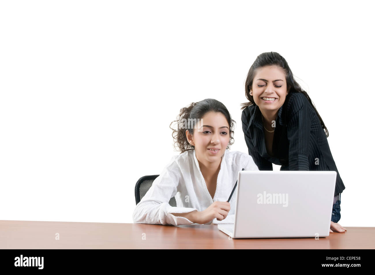 two girls working Stock Photo - Alamy