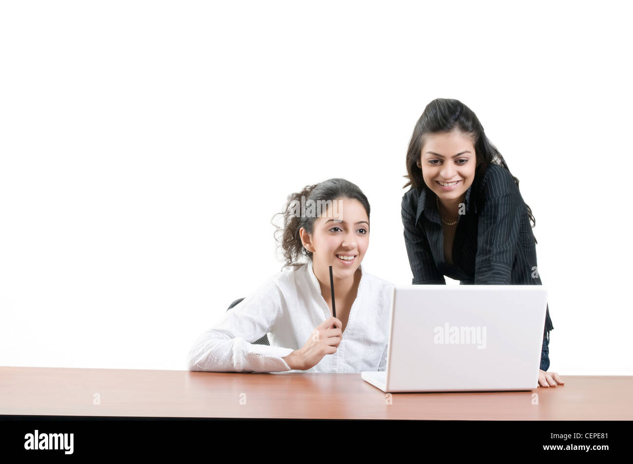 two girls working Stock Photo - Alamy