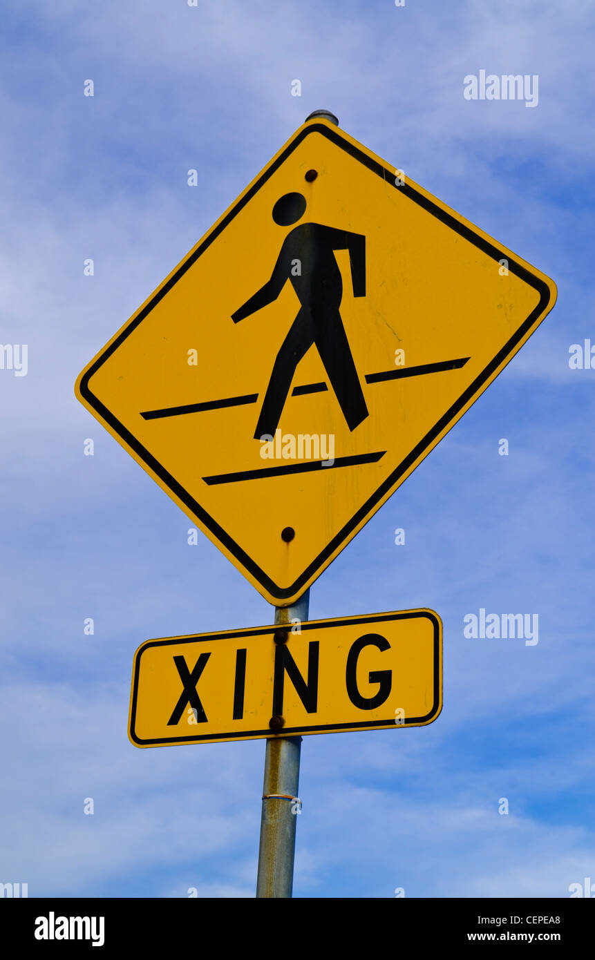 Yellow and black people crossing sign Stock Photo - Alamy