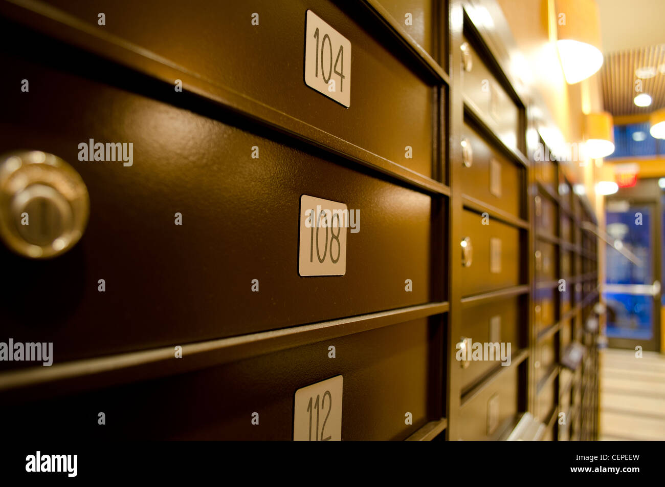 Brown mail boxes in a mail room Stock Photo - Alamy