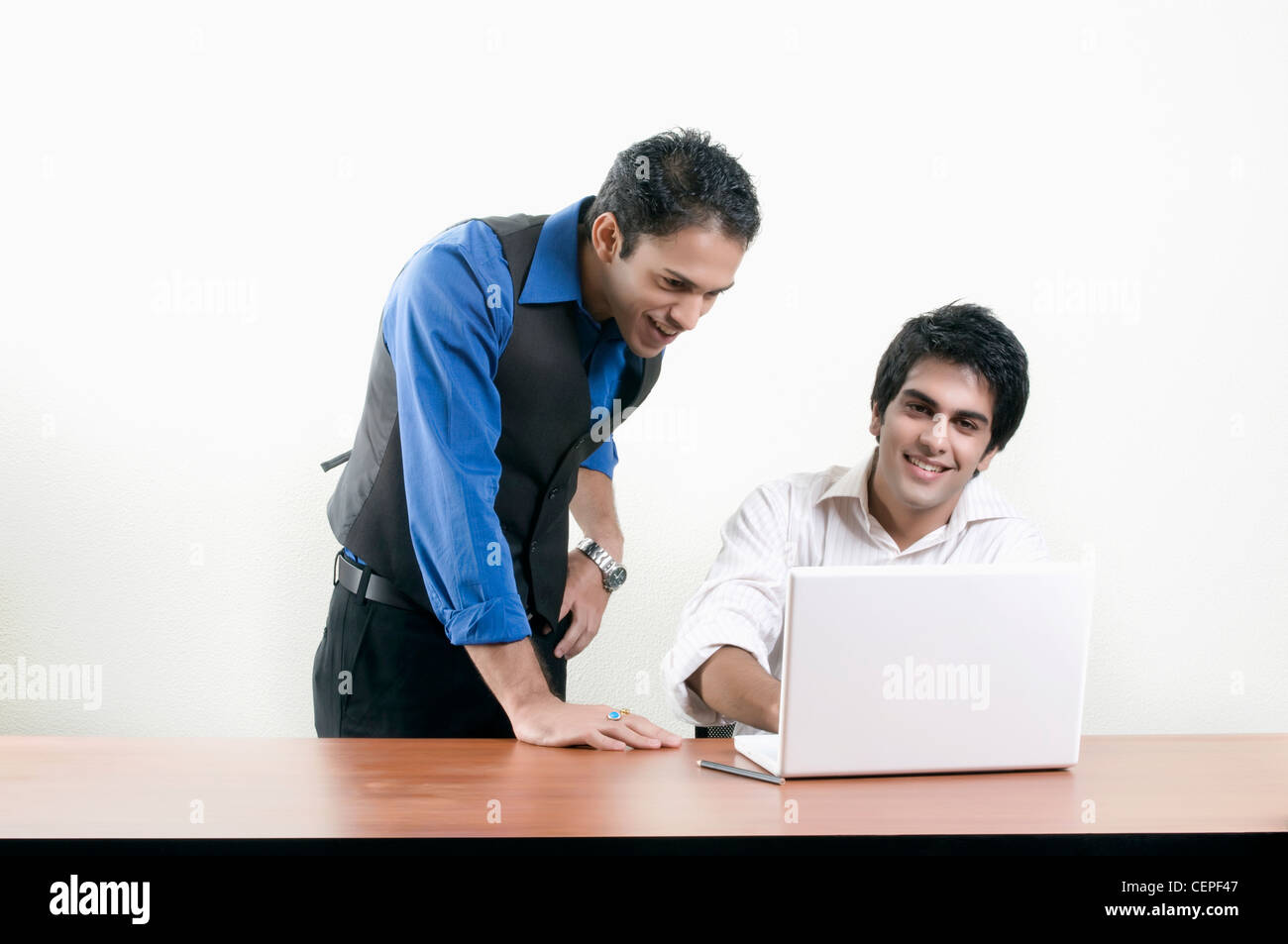 two men working Stock Photo - Alamy