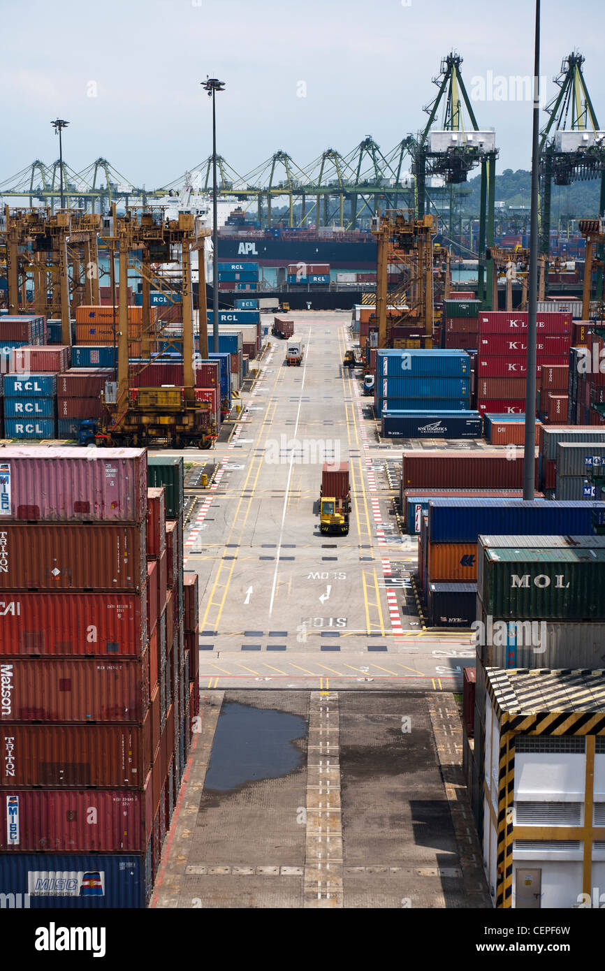 Trucks transport shipping containers at the Port of Singapore Stock ...