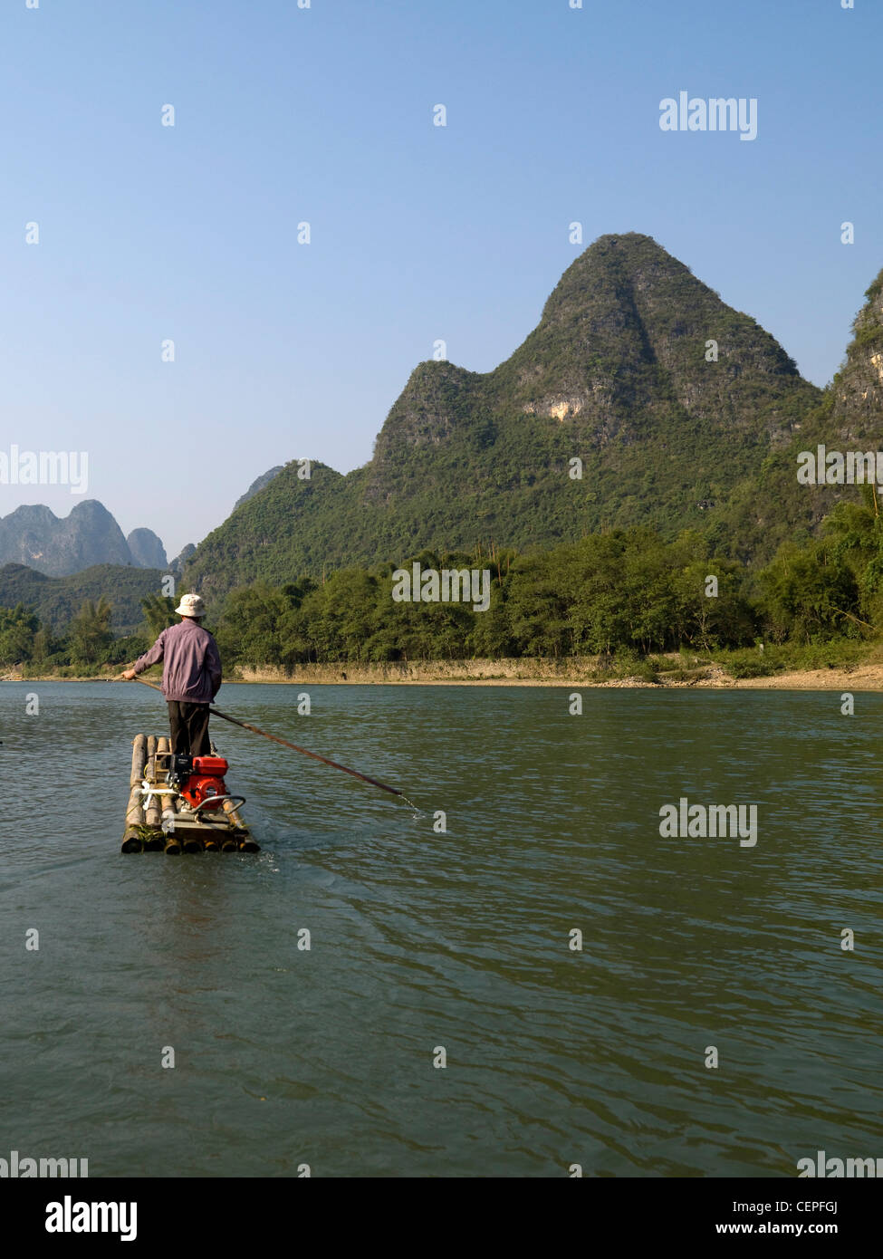 Man On A Raft In A River; Guangxi Zhuang,China Stock Photo - Alamy